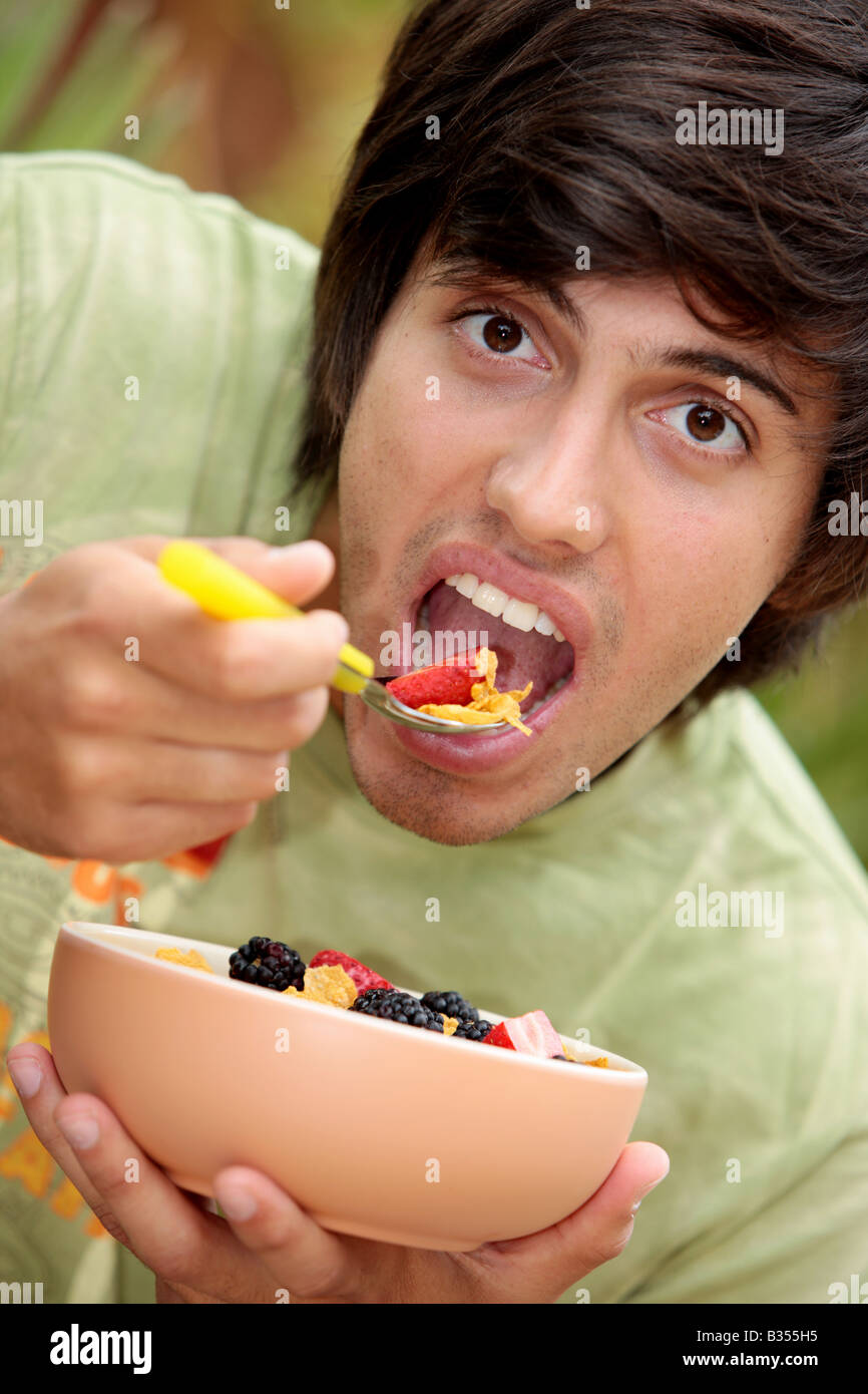 Teenage boy eating cornflakes hi-res stock photography and images - Alamy
