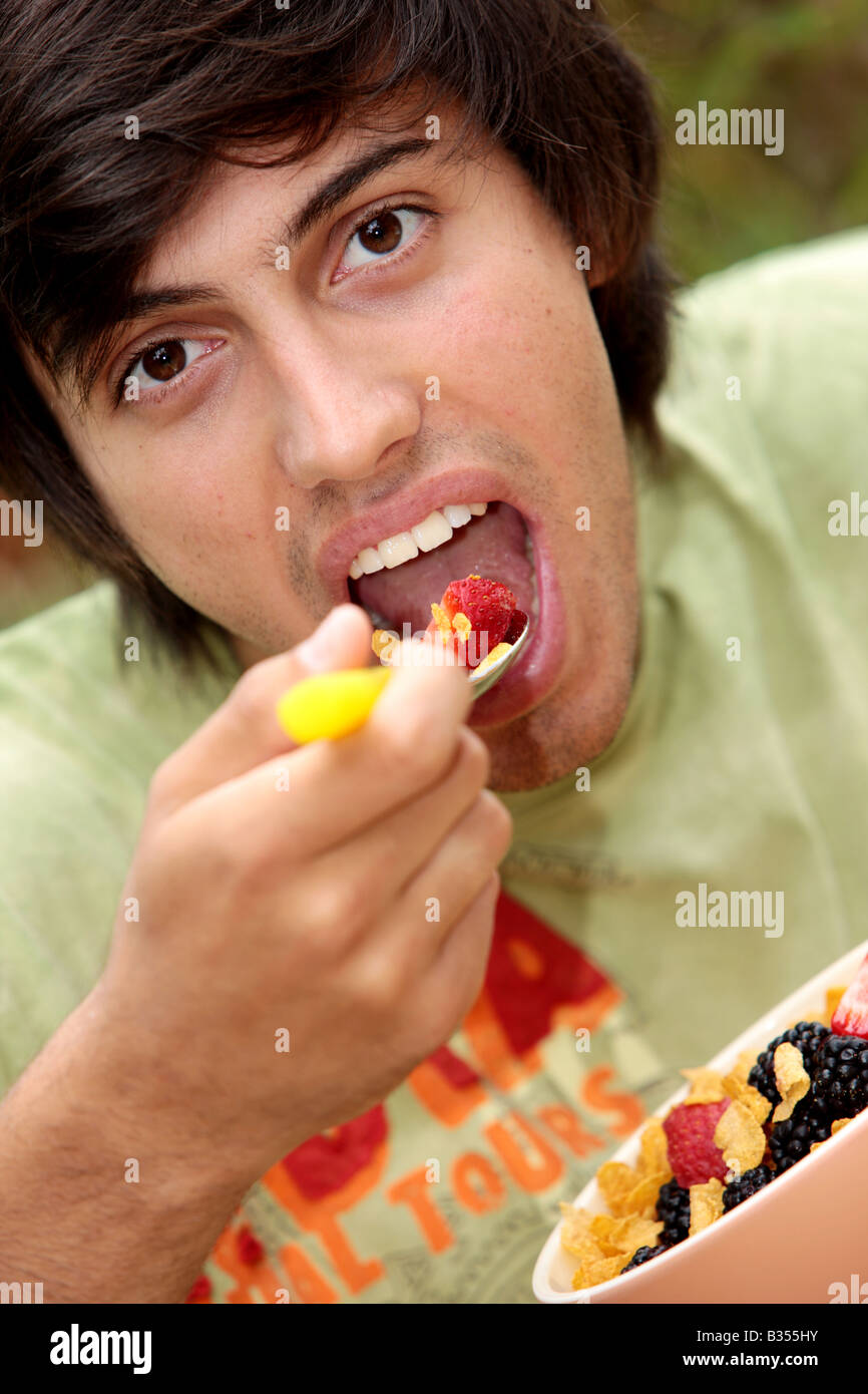 Teenage boy eating cornflakes hi-res stock photography and images - Alamy
