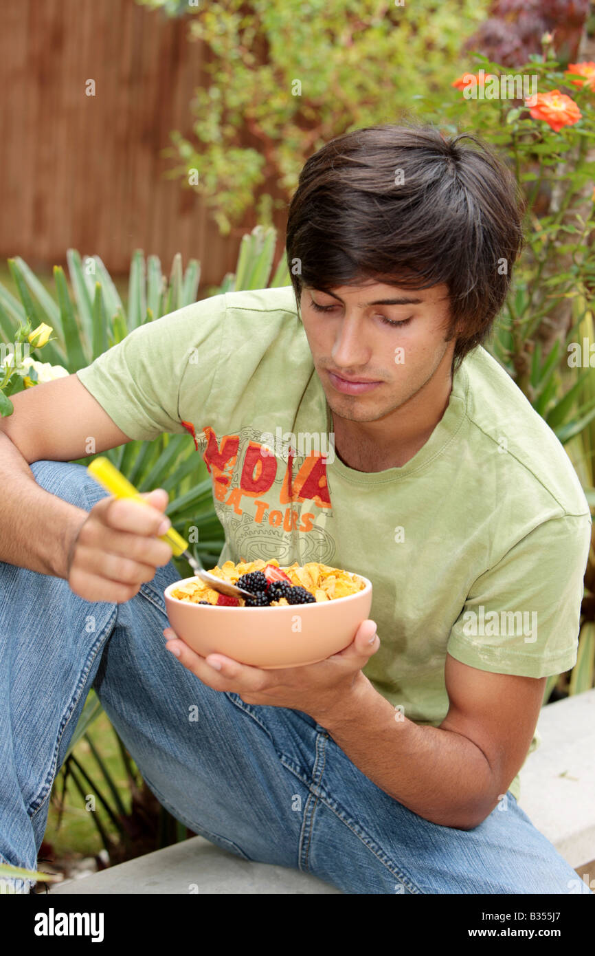 Teenage boy eating cornflakes hi-res stock photography and images - Alamy