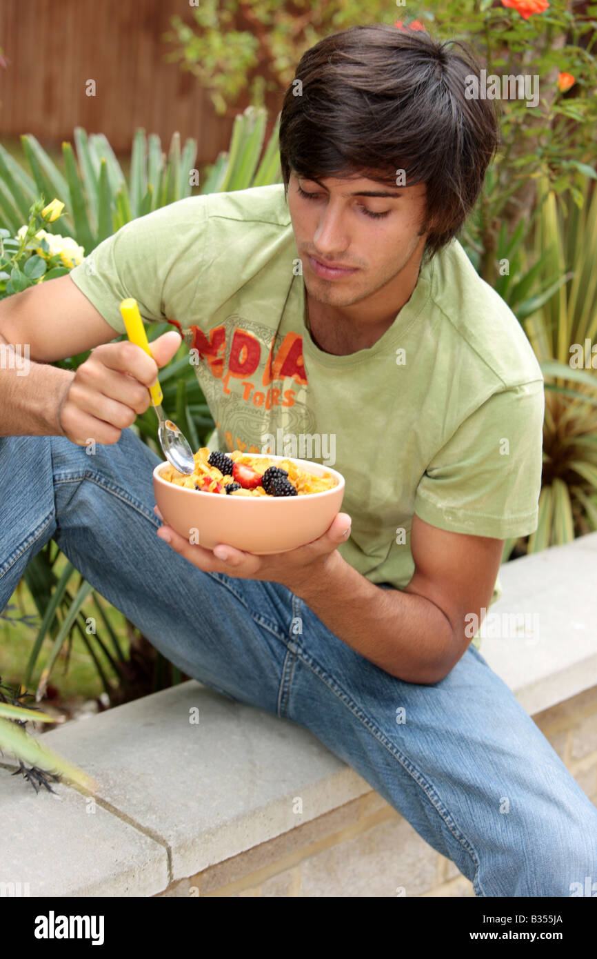 Teenage boy eating cornflakes hi-res stock photography and images - Alamy