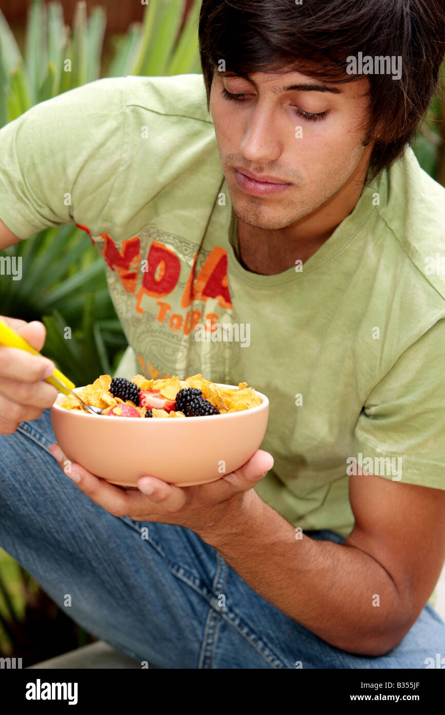 Teenage boy eating cornflakes hi-res stock photography and images - Alamy