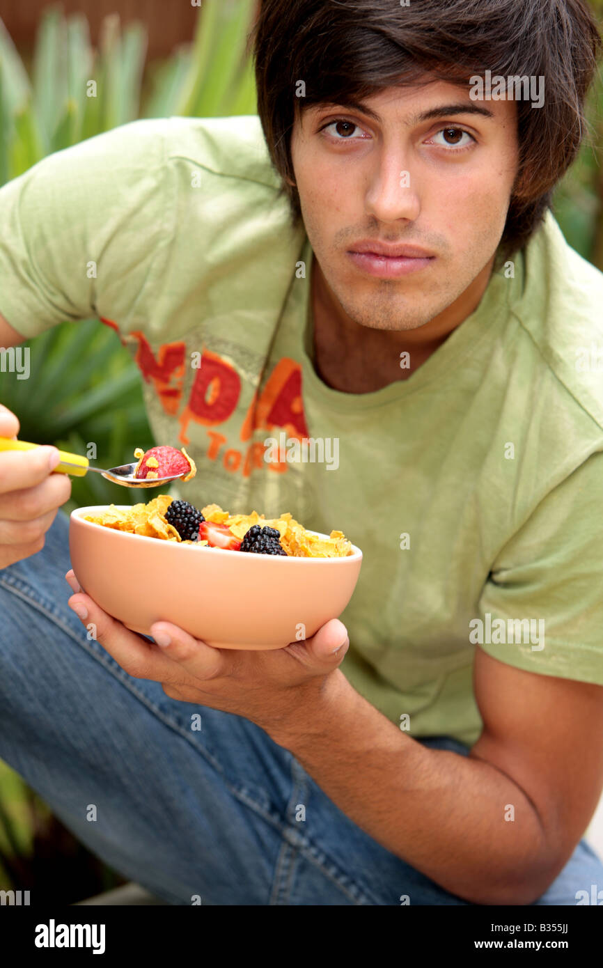 Teenage boy eating cornflakes hi-res stock photography and images - Alamy