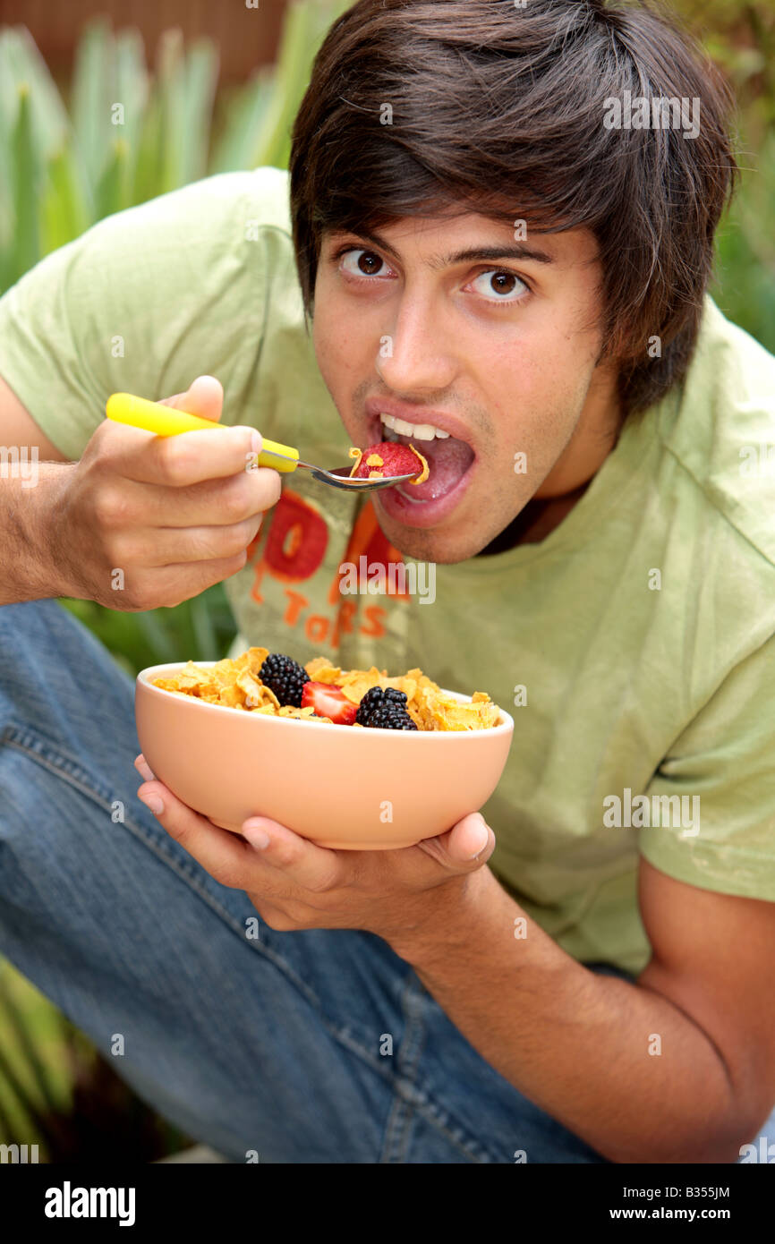 Teenage boy eating cornflakes hi-res stock photography and images - Alamy