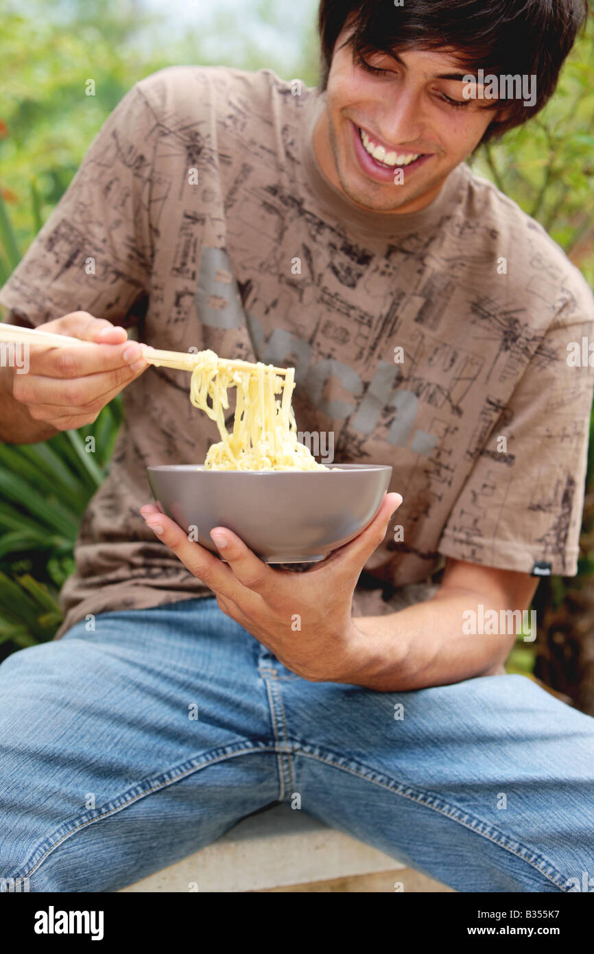 Young Man Eating Model Released Stock Photo - Alamy