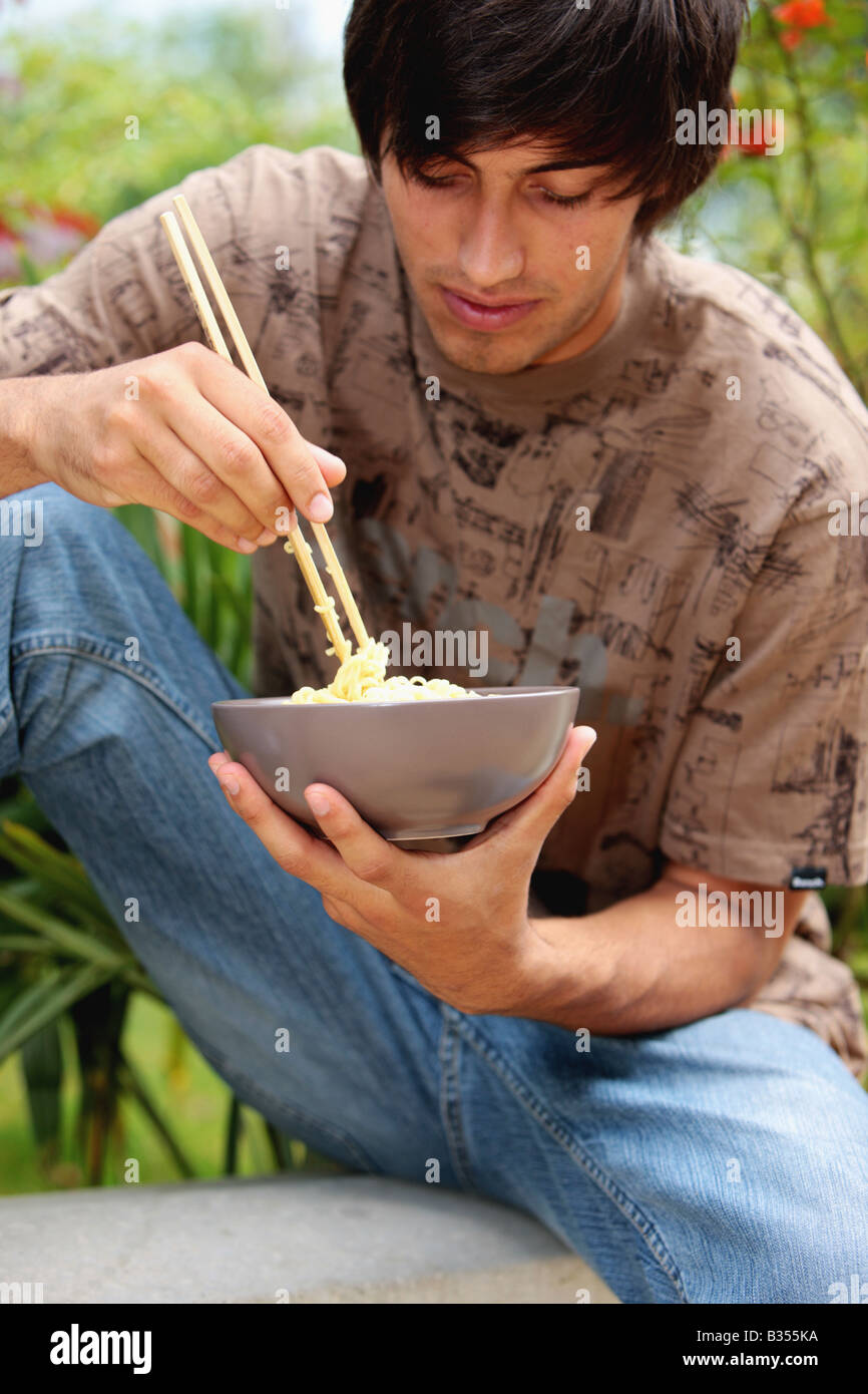 Young Man Eating Model Released Stock Photo - Alamy