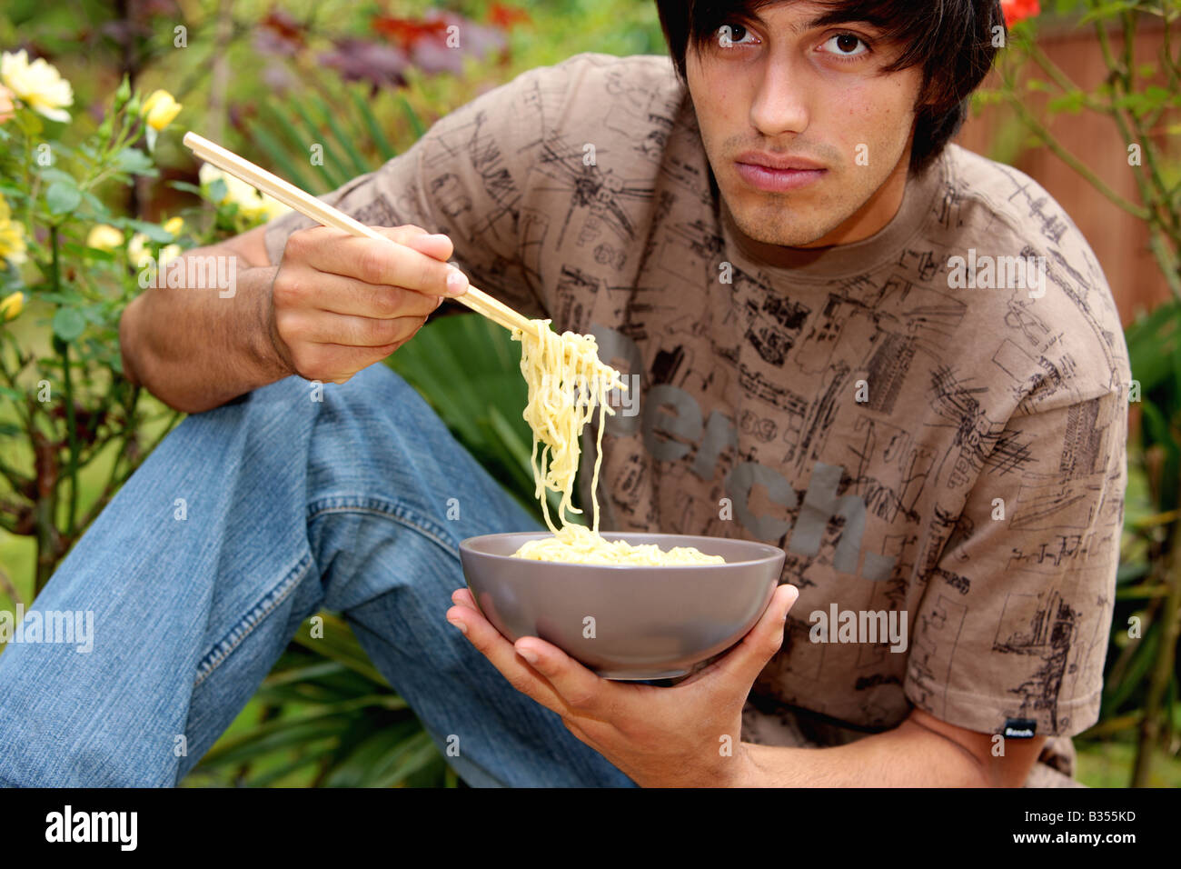 Young Man Eating Model Released Stock Photo - Alamy