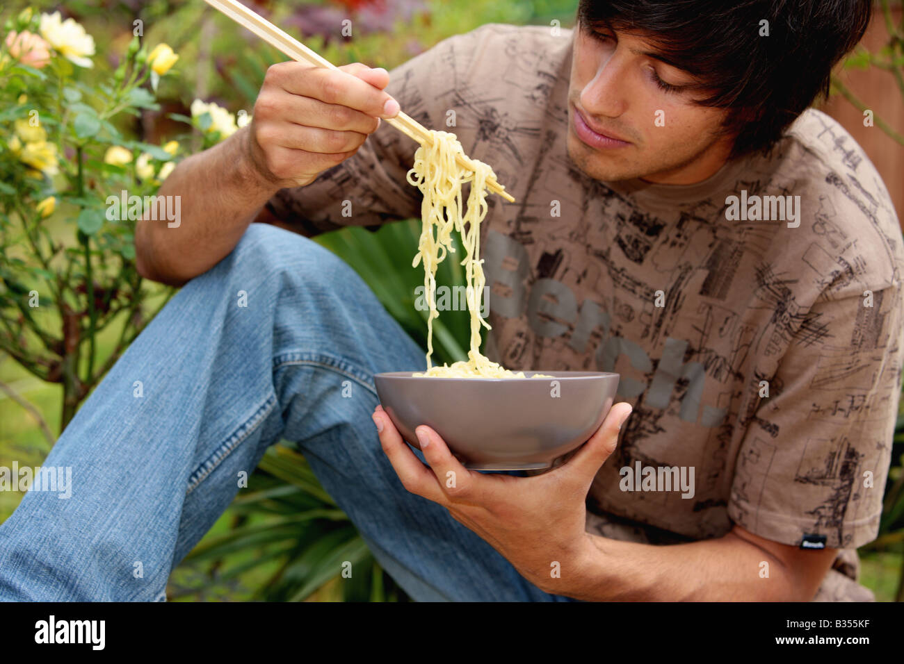 Young Man Eating Model Released Stock Photo - Alamy