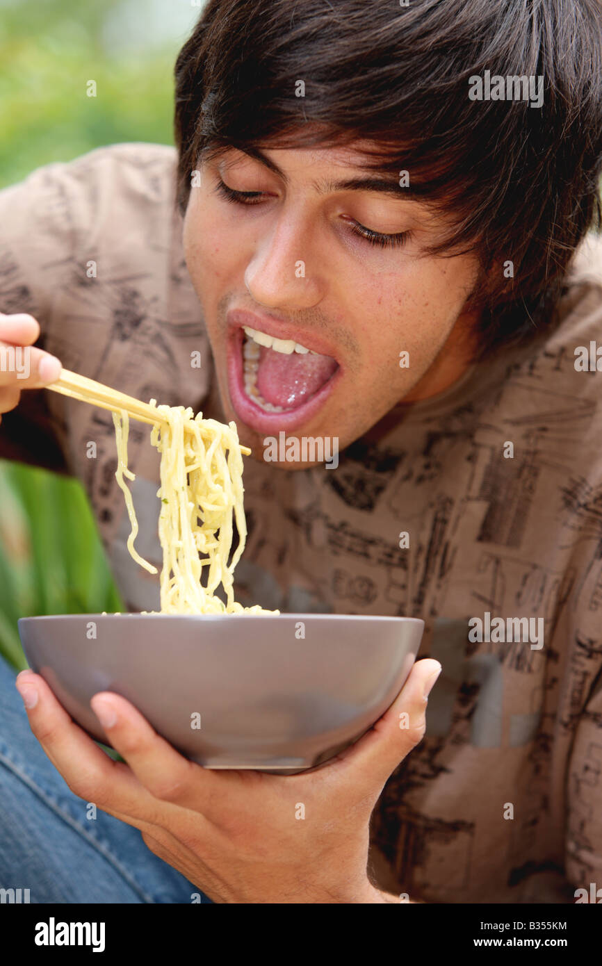 Young Man Eating Model Released Stock Photo - Alamy