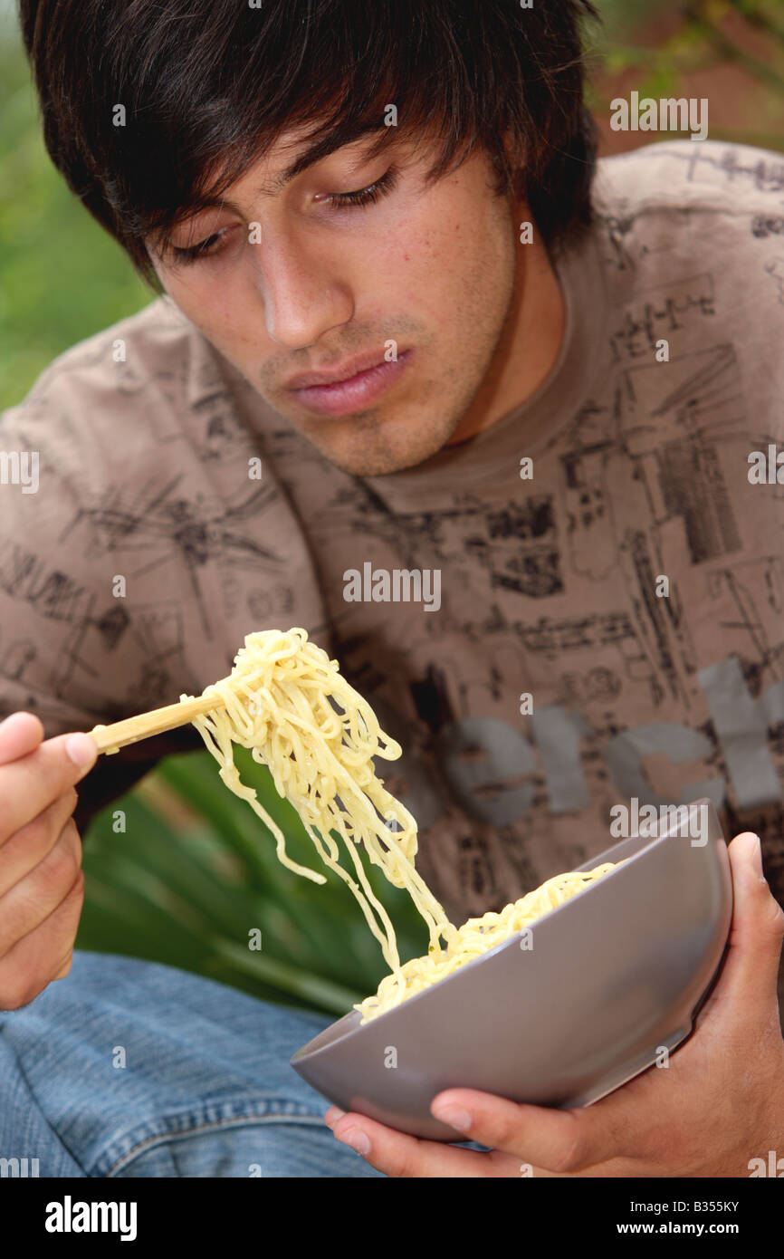 Young Man Eating Model Released Stock Photo - Alamy