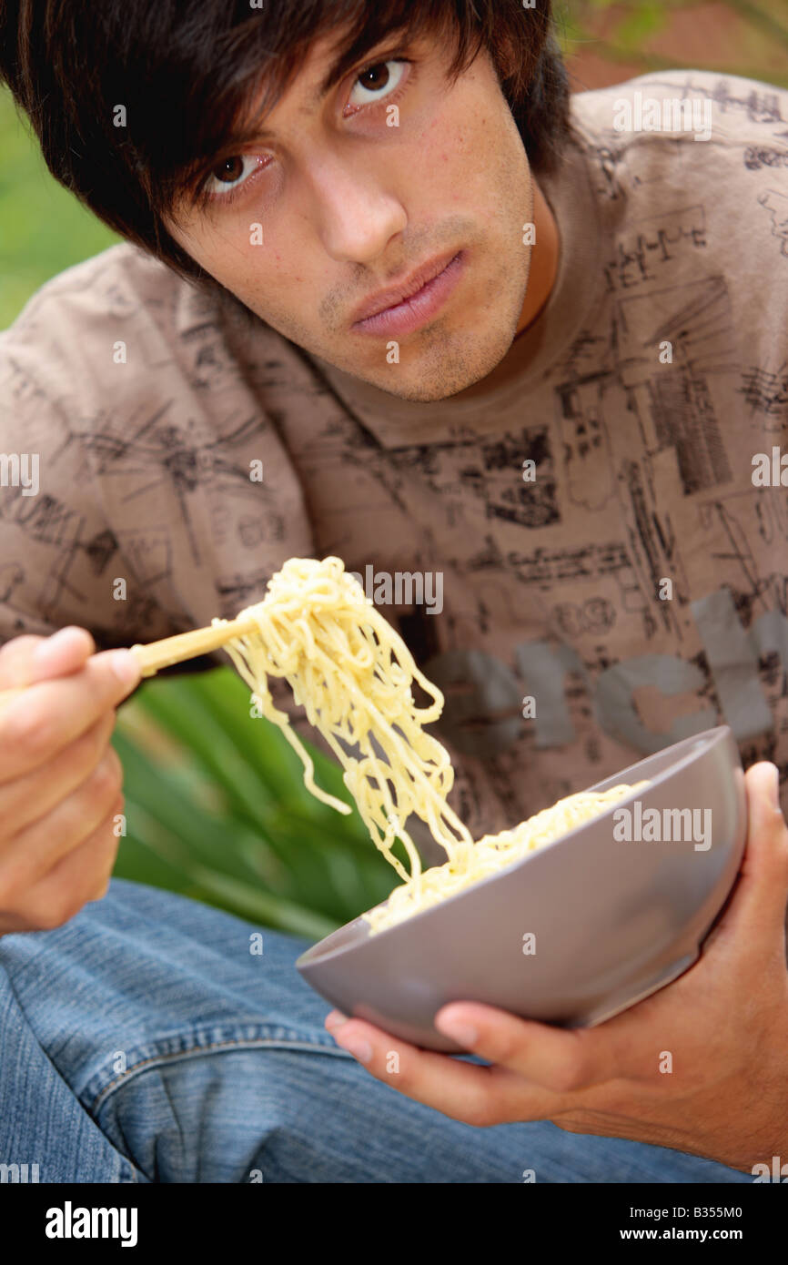 Young Man Eating Model Released Stock Photo - Alamy