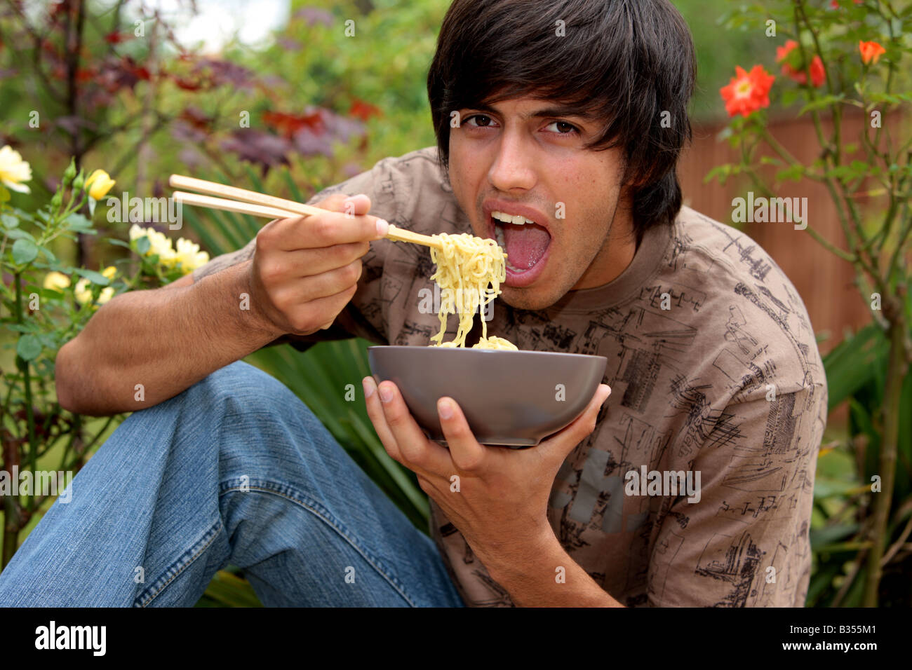 Young Man Eating Model Released Stock Photo - Alamy