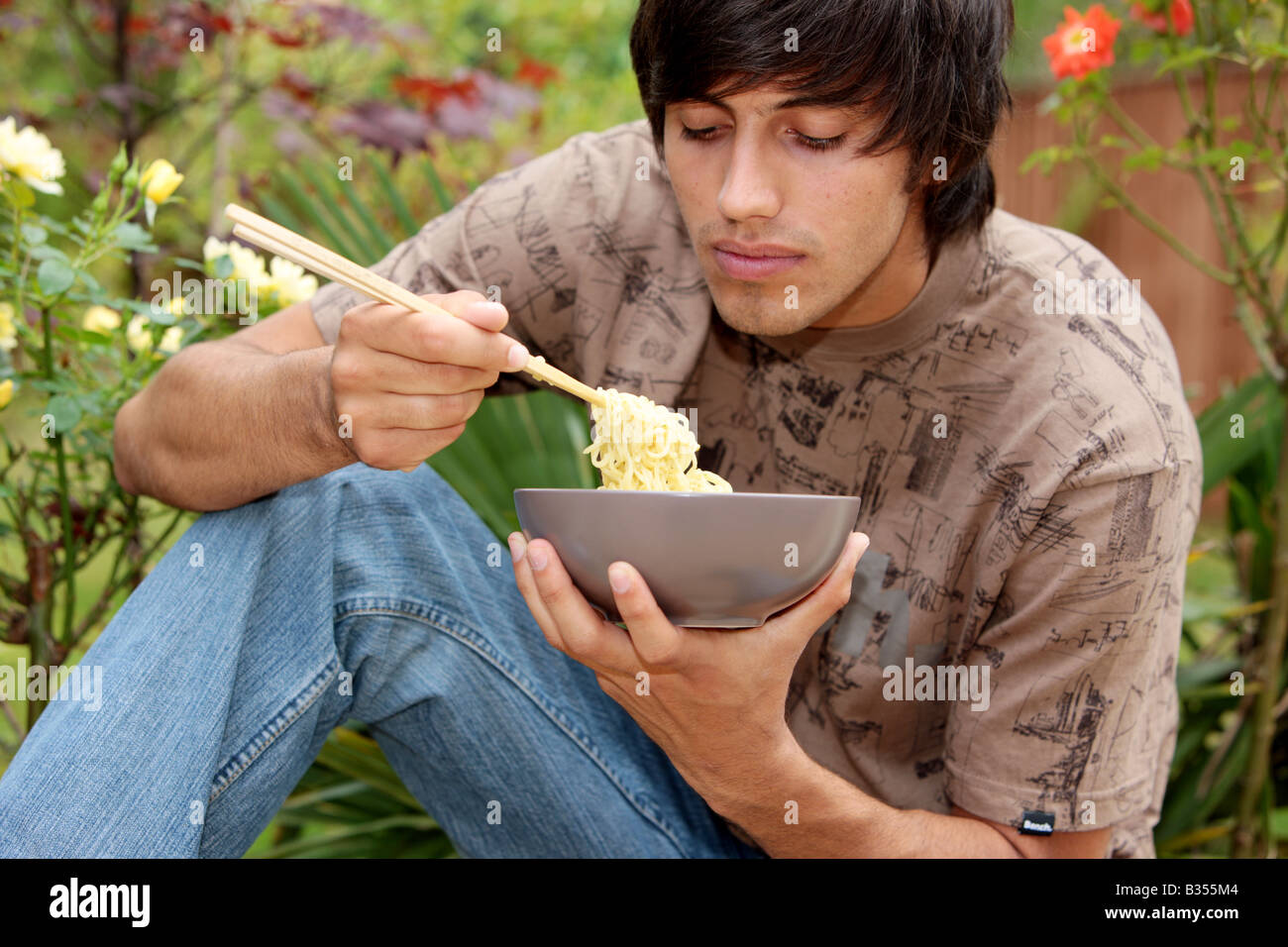 Young Man Eating Model Released Stock Photo - Alamy