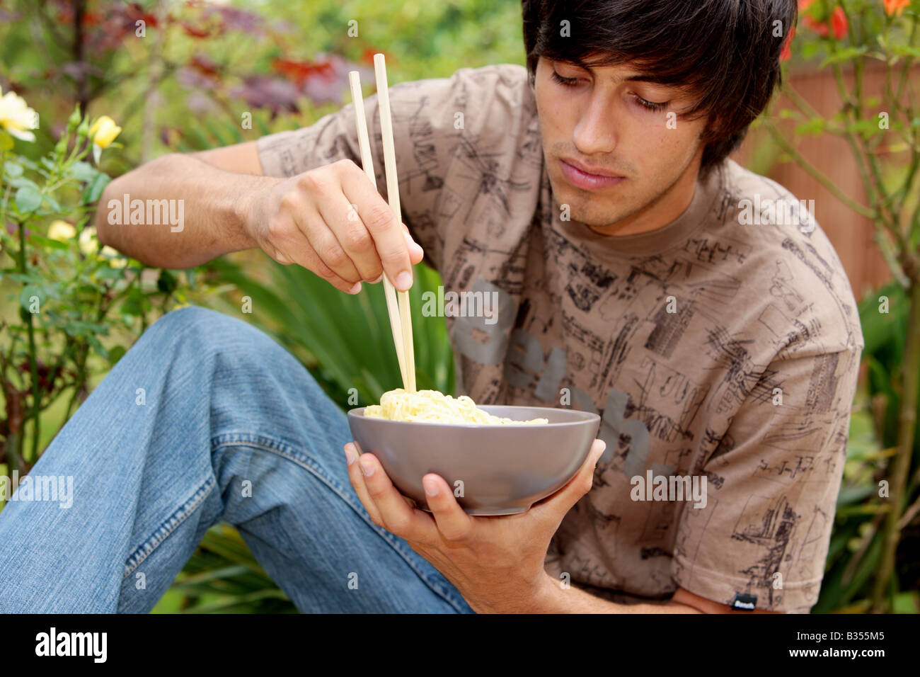 Young Man Eating Model Released Stock Photo - Alamy