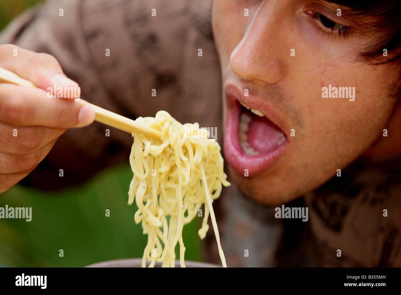 Young Man Eating Model Released Stock Photo - Alamy