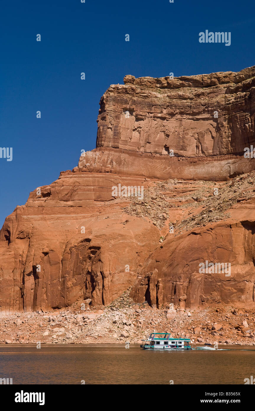 Houseboat and sandstone cliffs at Lake Powell Glen Canyon National ...