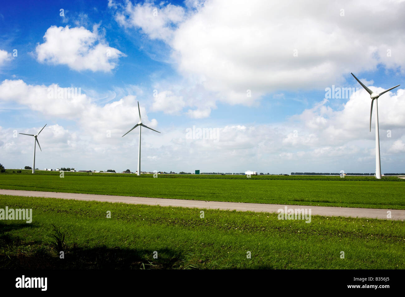 row of wind turbines in a field Stock Photo - Alamy