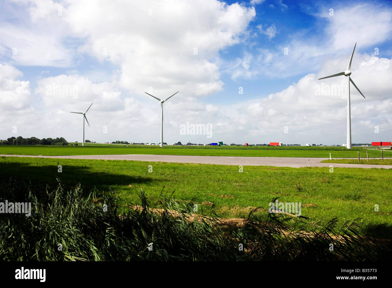 row of wind turbines in a field Stock Photo - Alamy