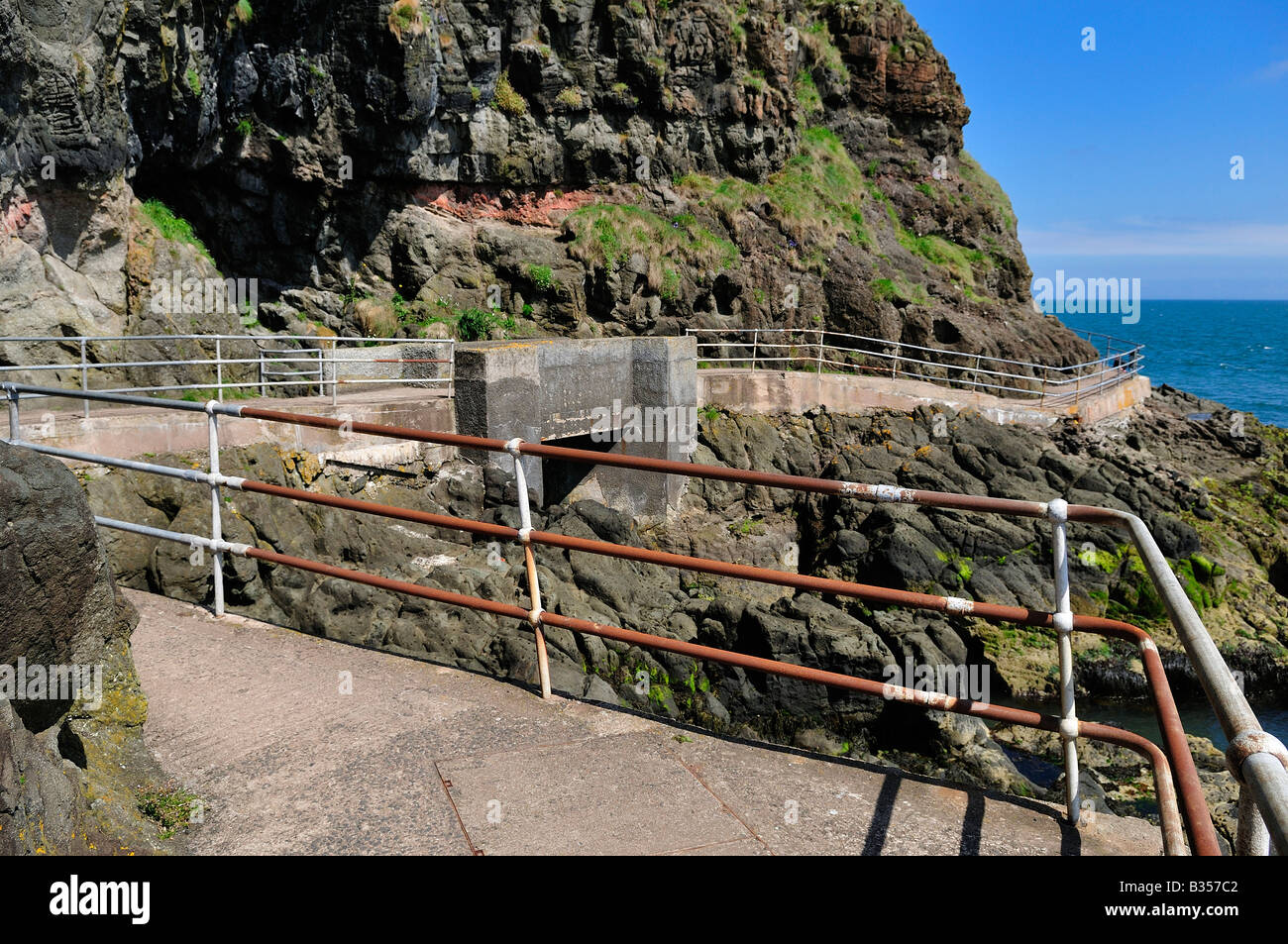 Pathway that leads around the bottom of the cliffs at Whitehead ...