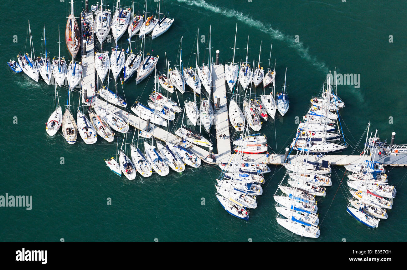 Aerial view of a group of yachts moored up to a floating pontoon in the ...