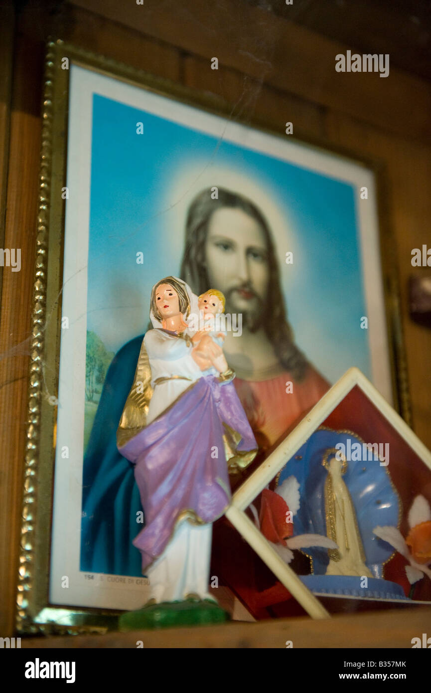 Traditional Roman Catholic household shrine with a picture of Jesus and ...