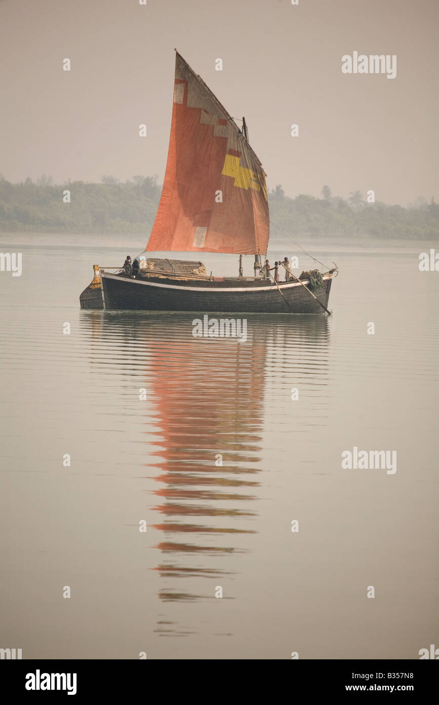 A junk style boat sails on the Ganges delta in the Sunderbans National ...