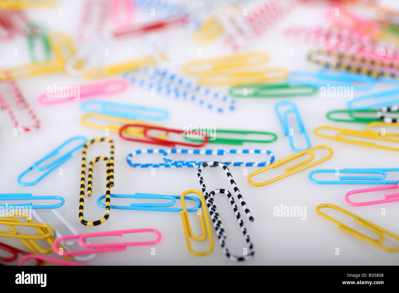 Coloured and patterned paper clips on a white background Stock Photo ...