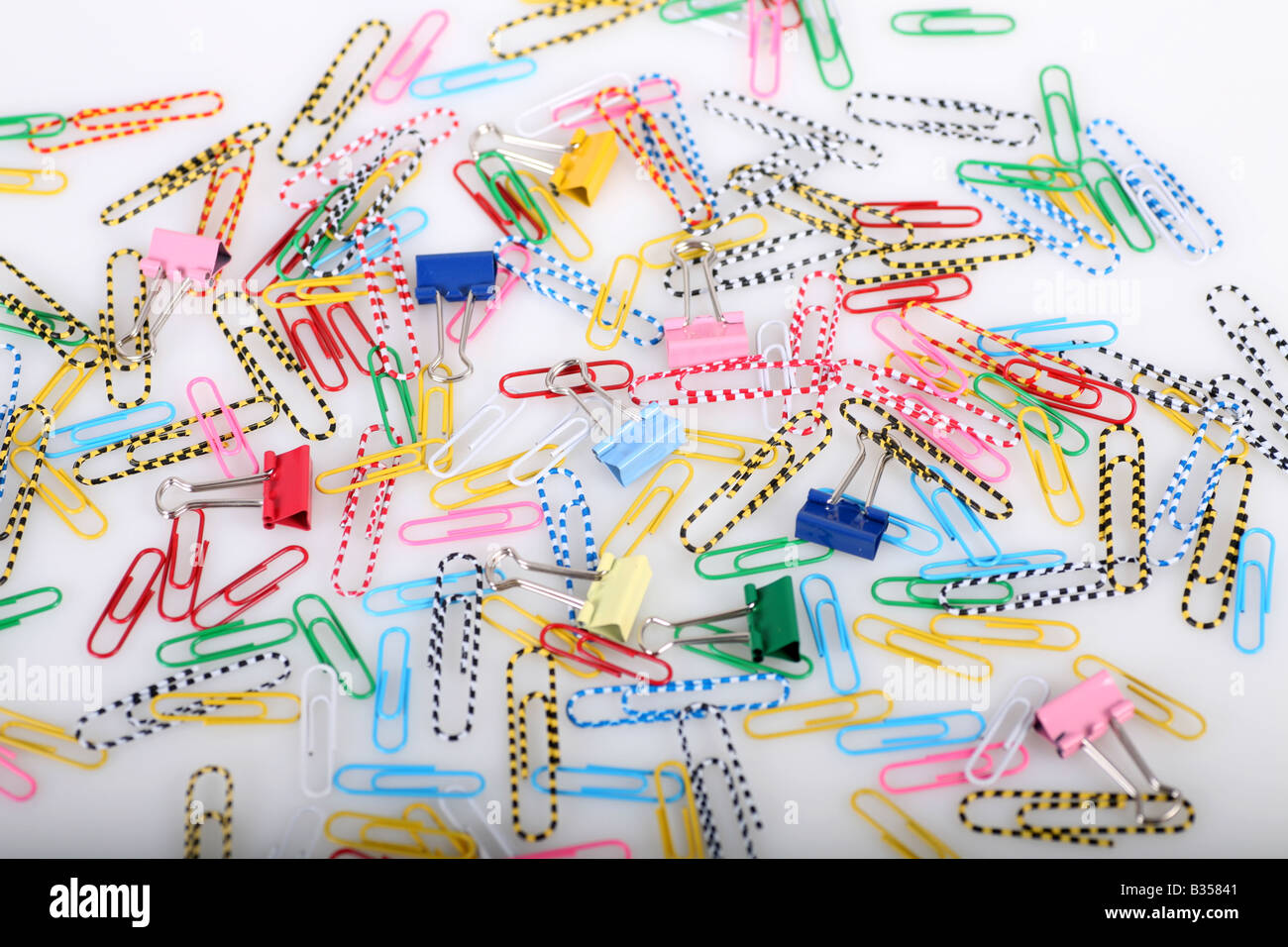 Coloured and patterned stationery sprawled on a white surface Stock ...