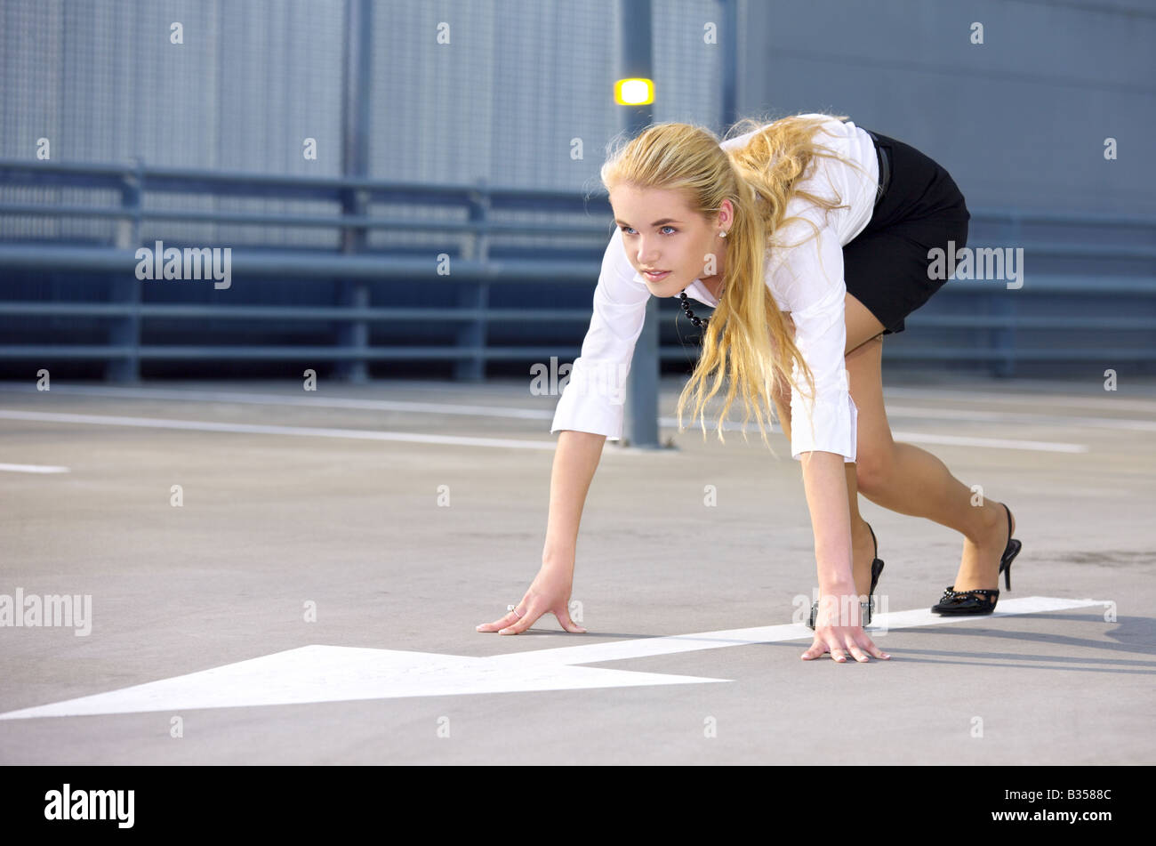 arrow pointer and confident businesswoman ready for race Stock Photo ...