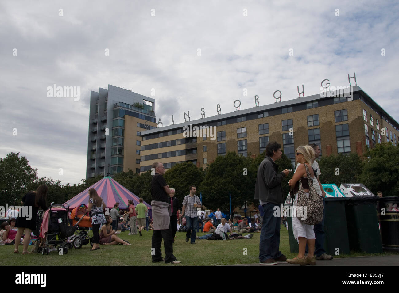 People enjoying Hoxton festival in Hoxton Park, Ainsborough building ...