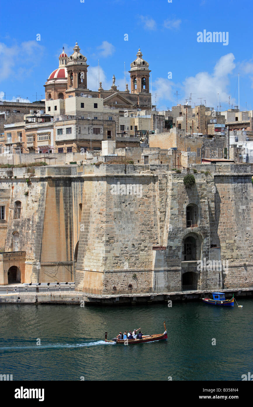 Maltese Gondola or Dghajsa and church of Our Lady of Victory, Senglea ...