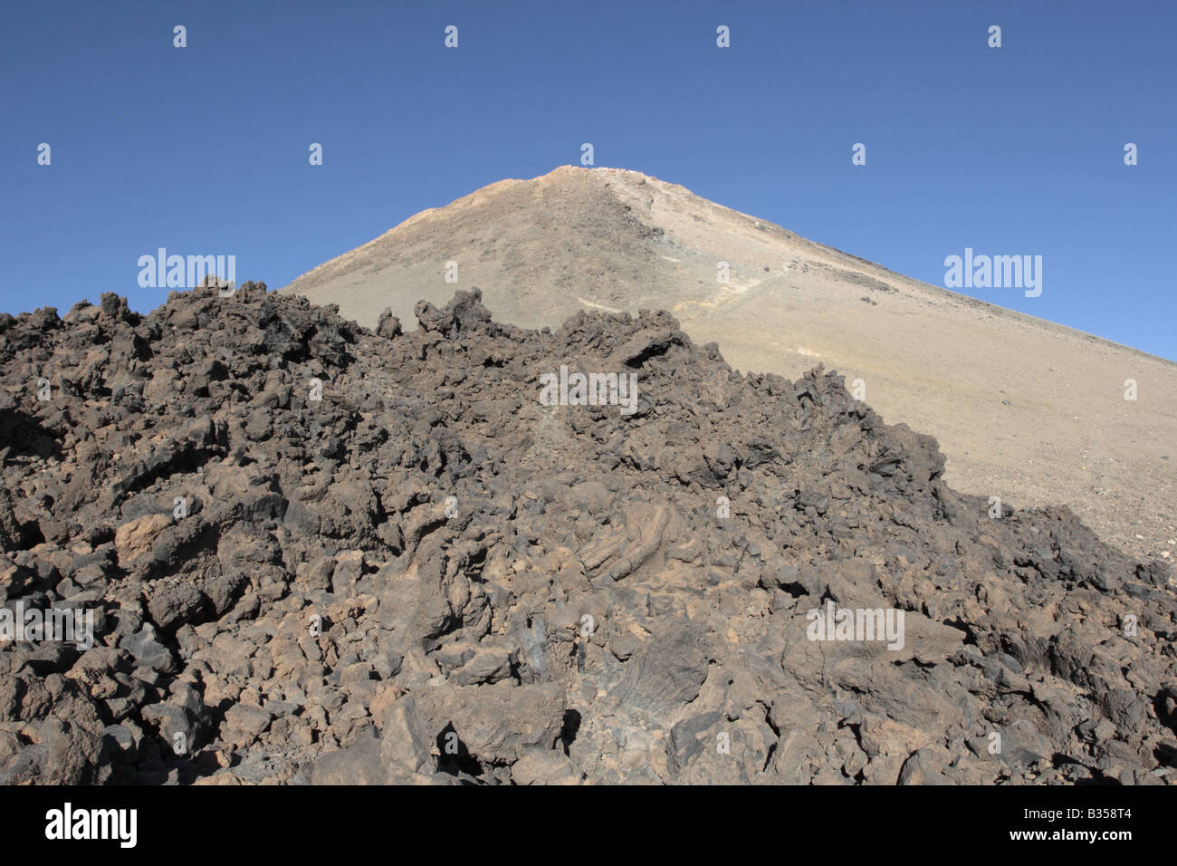 A solidified lava flow running down the side of mount Teide about 200 ...