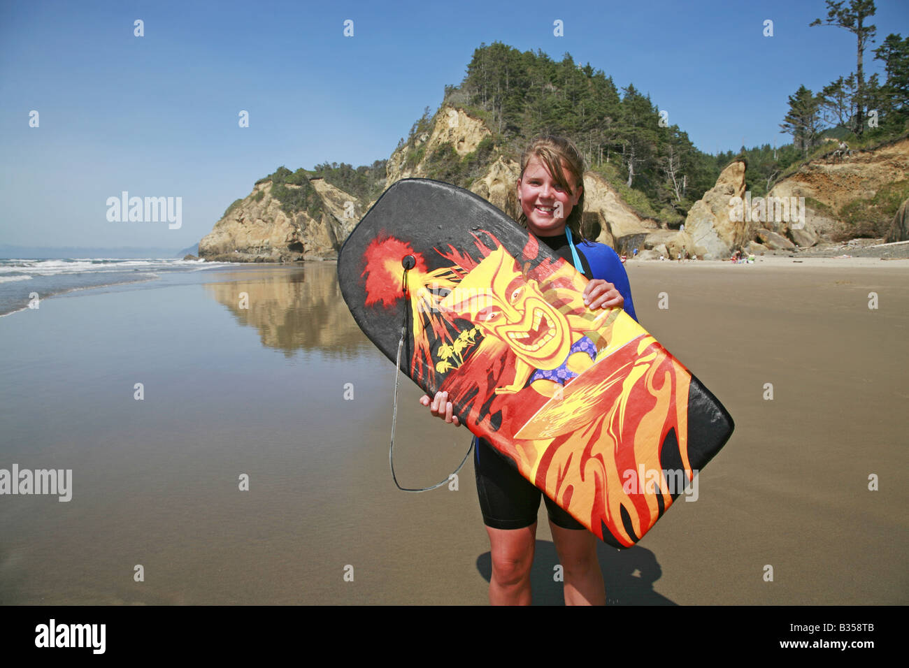 A boogy boarder waits for good body surfing waves at Hug Point State ...