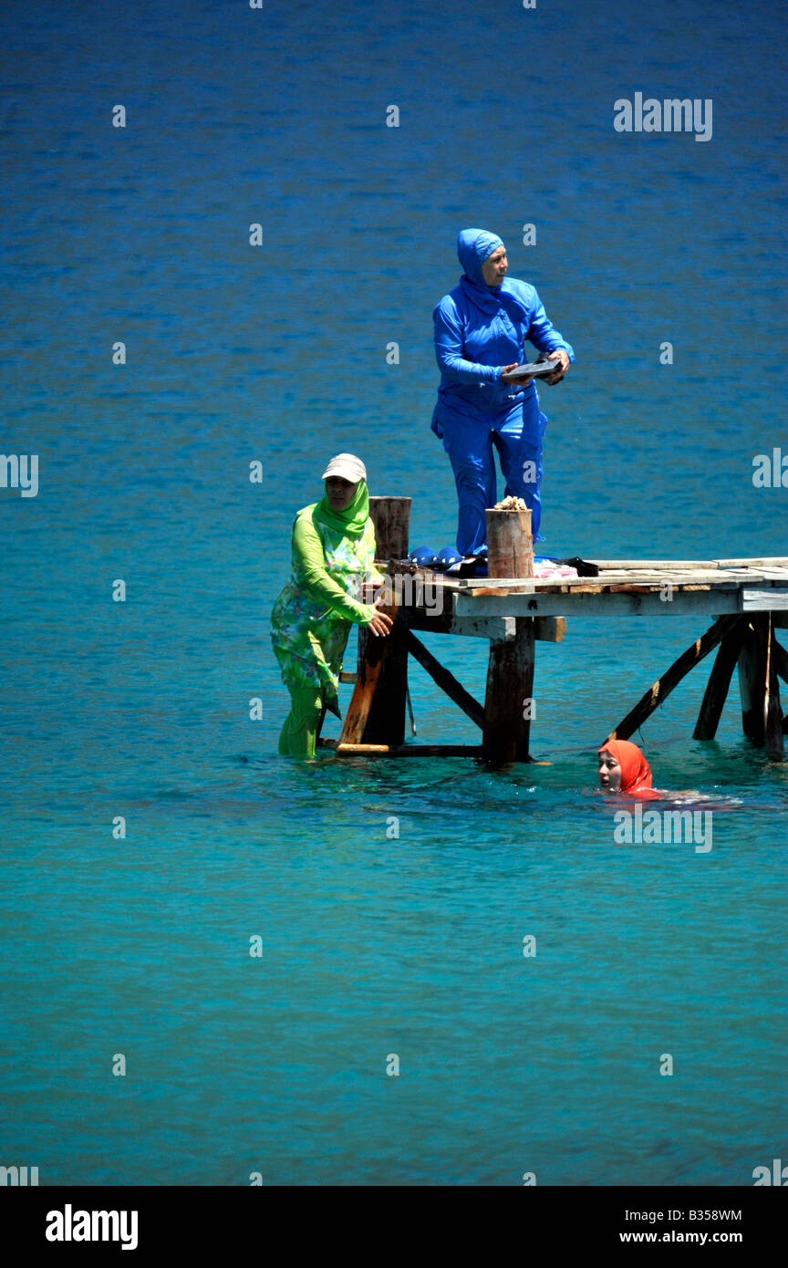 Turkish women covered up in full suit whilst swimming on holiday in ...