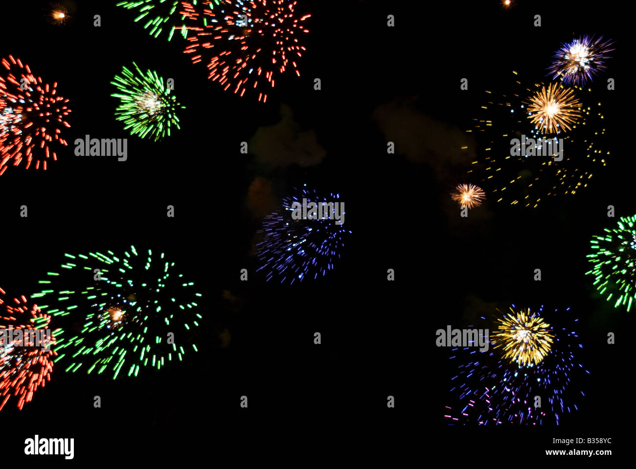 Clusters of multi coloured fireworks explode simultaenously over Lake ...