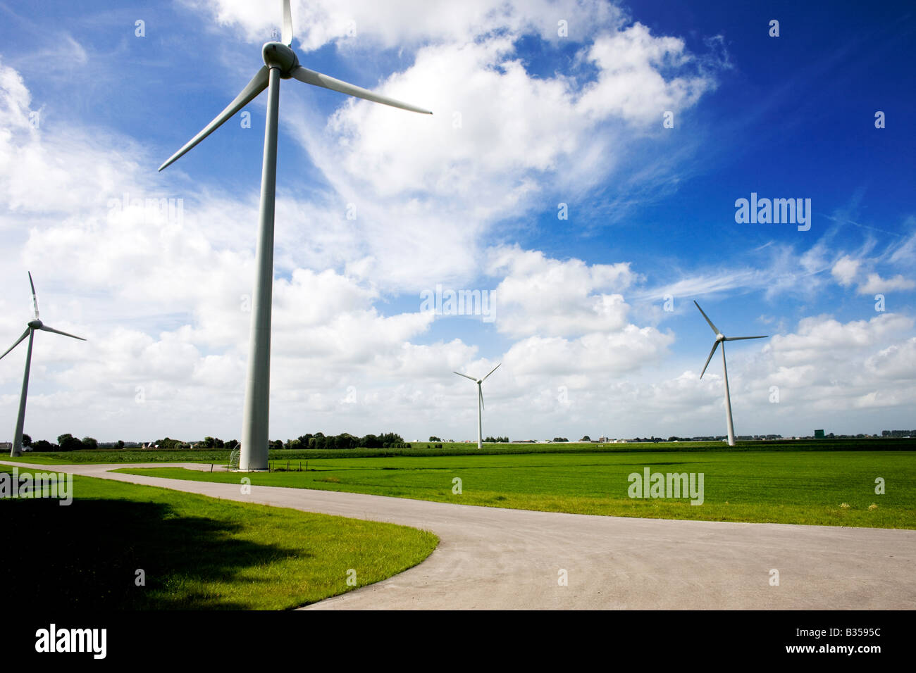 row of wind turbines in a field Stock Photo - Alamy