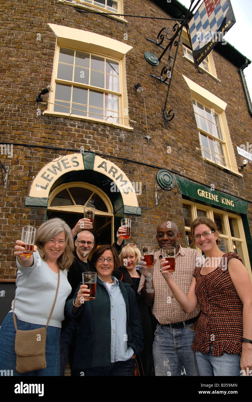 The Friends of the Lewes Arms celebrate after Harveys beer is restored ...