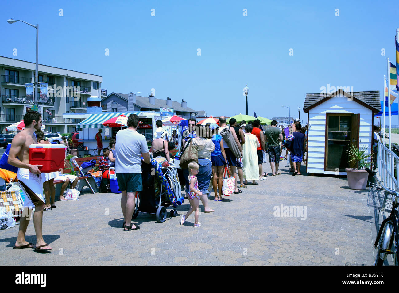 Long line forms at the beach ticket booth Stock Photo - Alamy