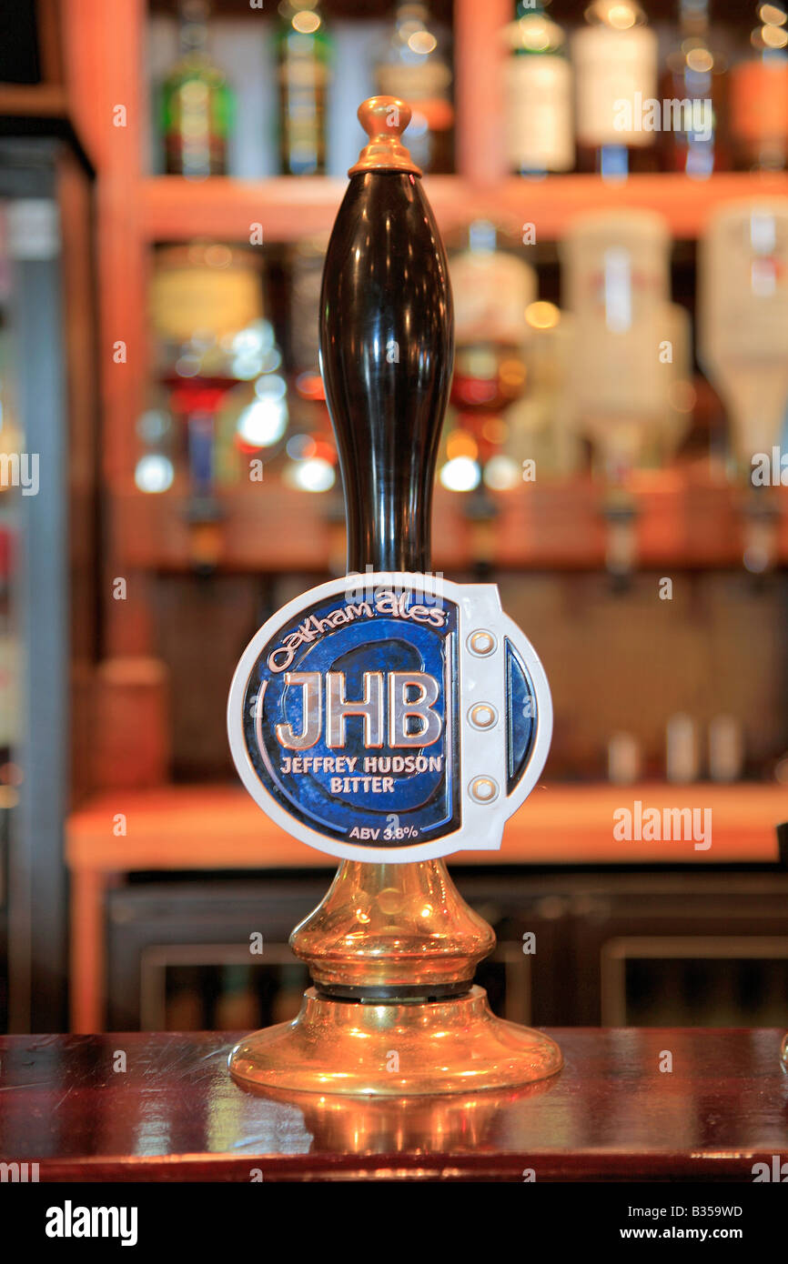 Beer Pump of JHB Ale from Oakham Ales Brewery in a pub bar setting real ...