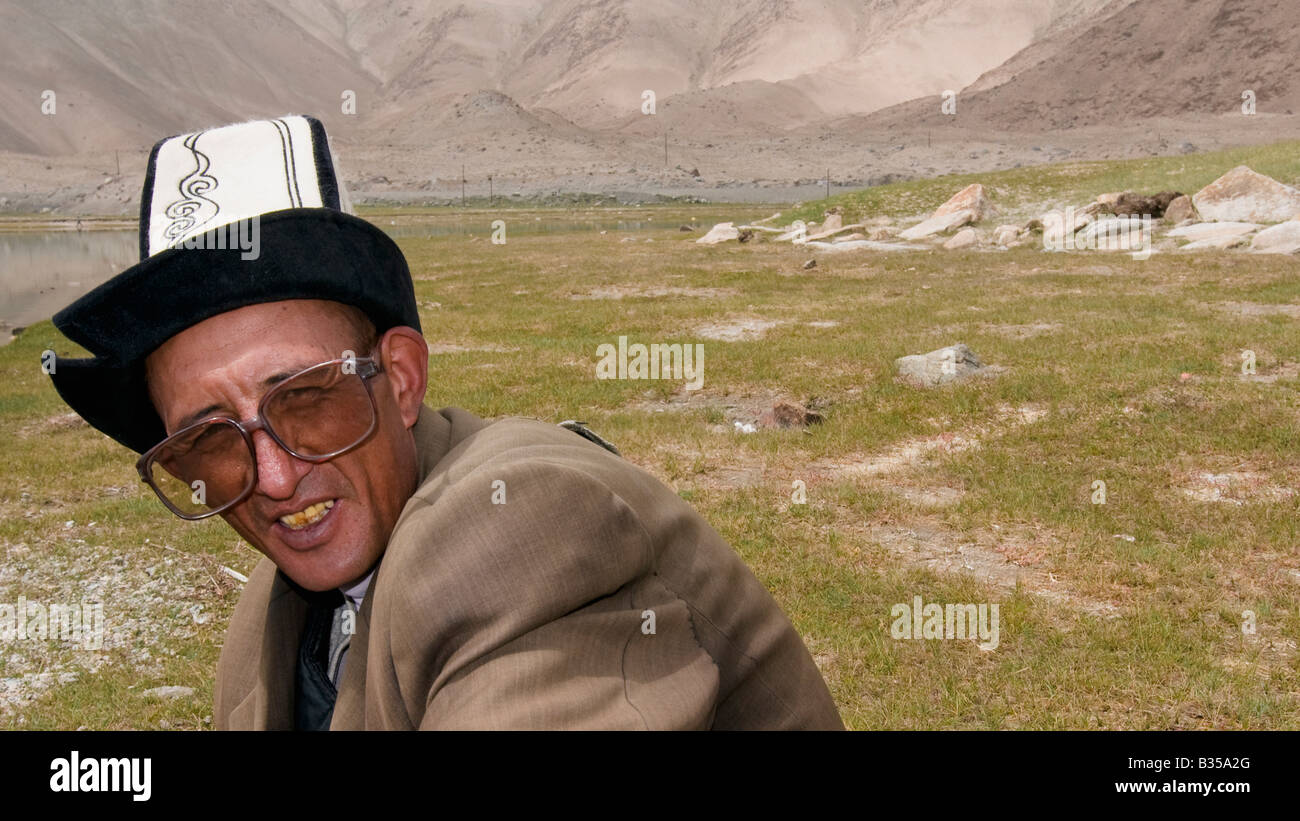China Xinjiang Man next to Karakul Lake Stock Photo - Alamy