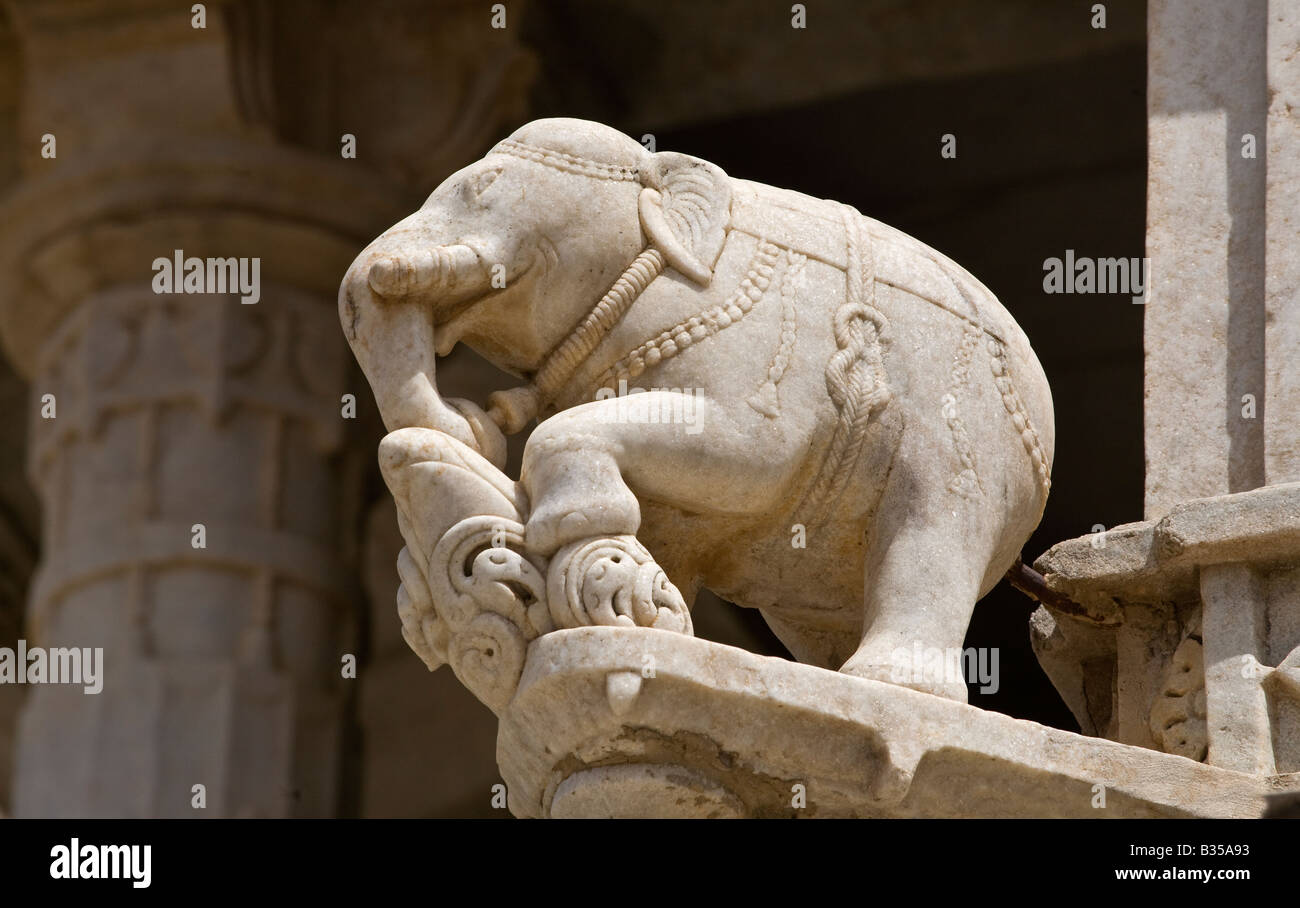 An ELEPHANT carved from white marble decorates the CHAUMUKHA MANDIR ...