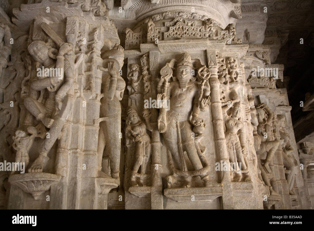 CELESTIAL DEITIES carved from white marble inside the CHAUMUKHA MANDIR ...