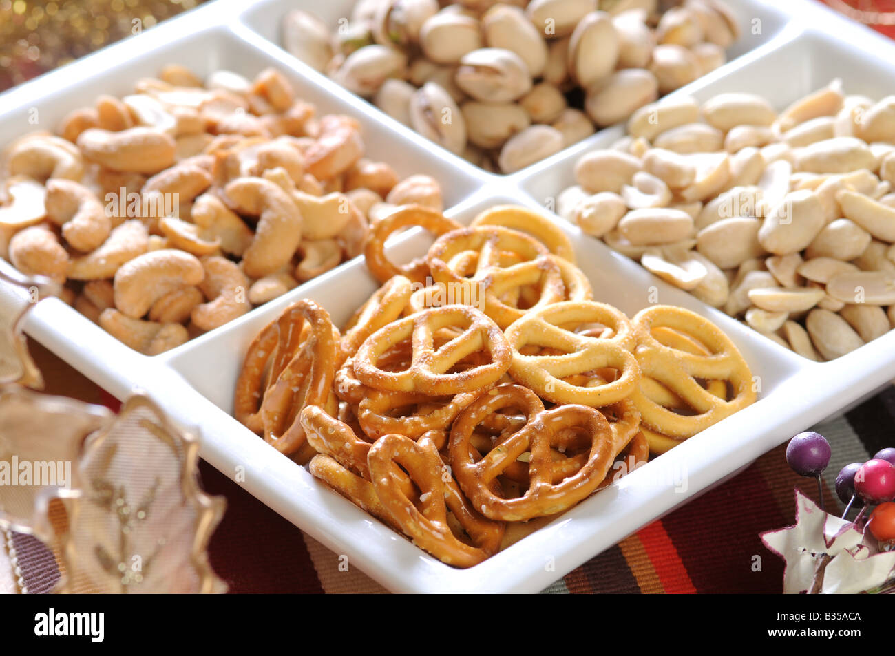 a plate of christmas party snacks nuts Stock Photo - Alamy