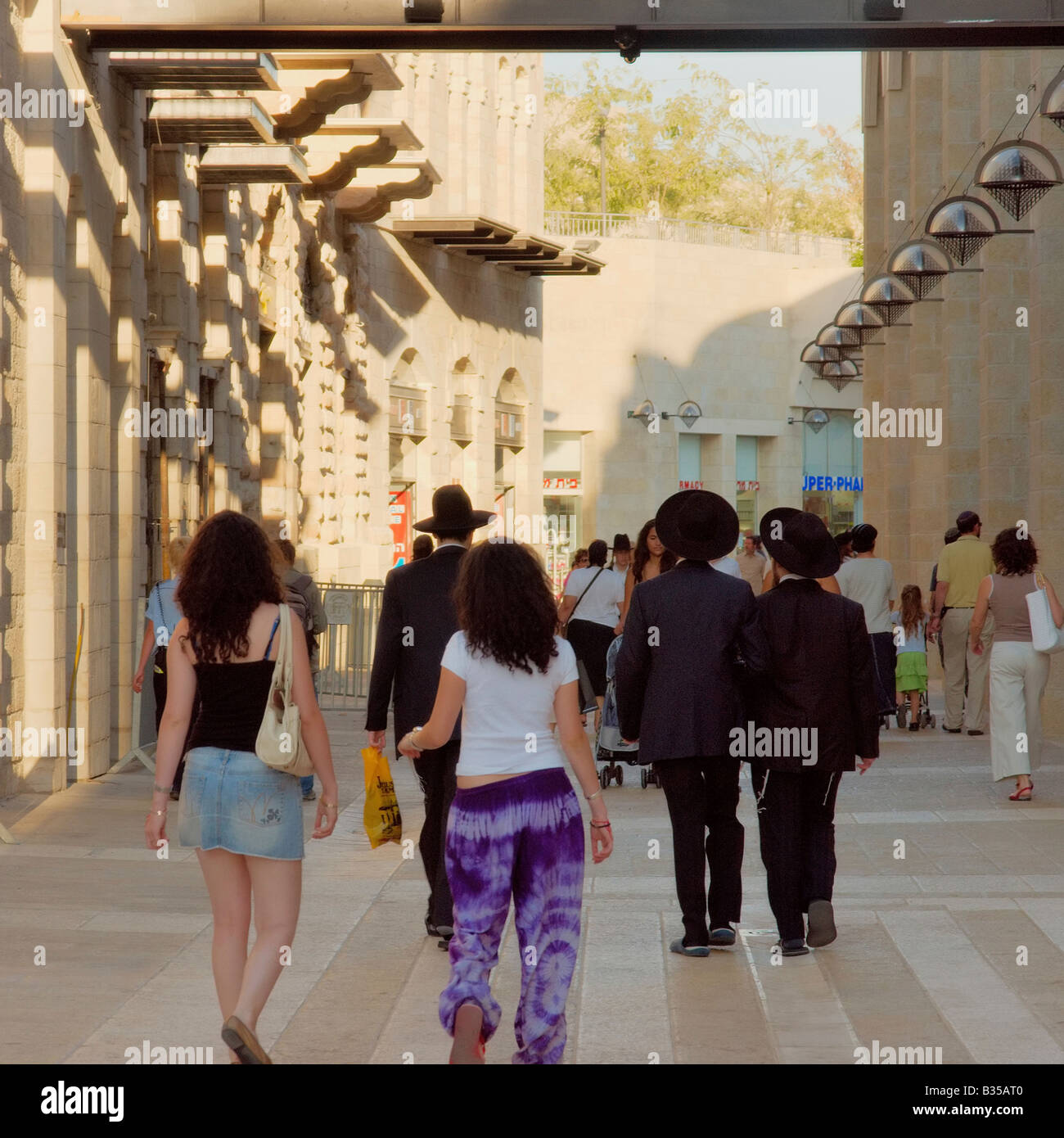 Two girls,one in a mini skirt and skivvy,walk in the new Mamilla ...