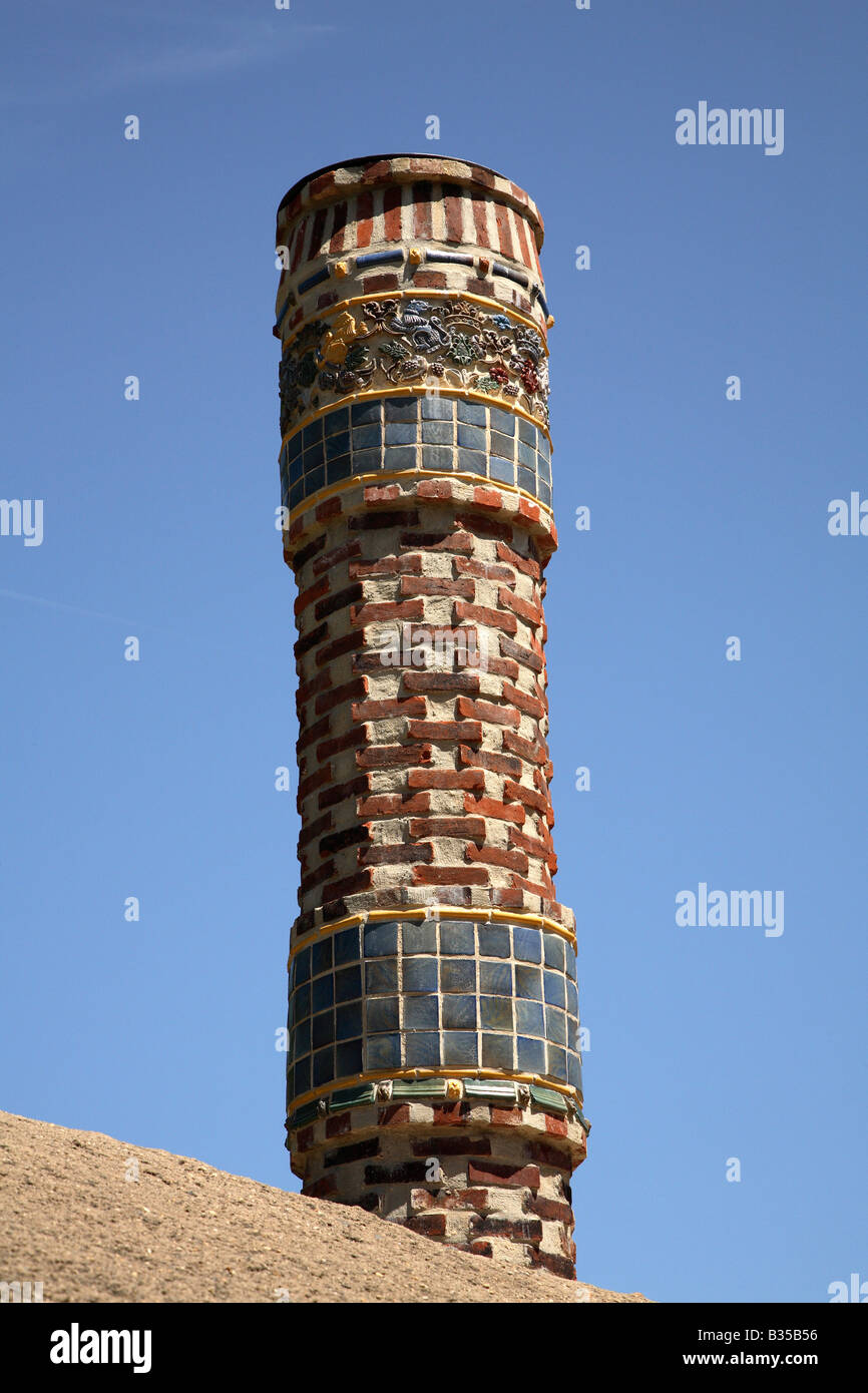 Round brick chimney with lots of decorative glazed tile Stock Photo - Alamy