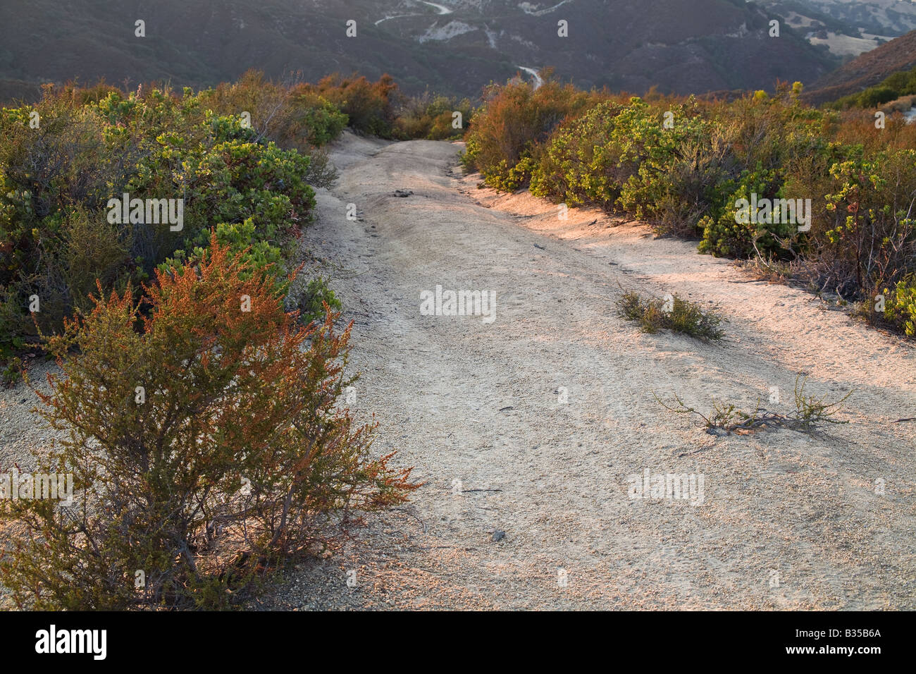 Country road down the mountain Stock Photo - Alamy