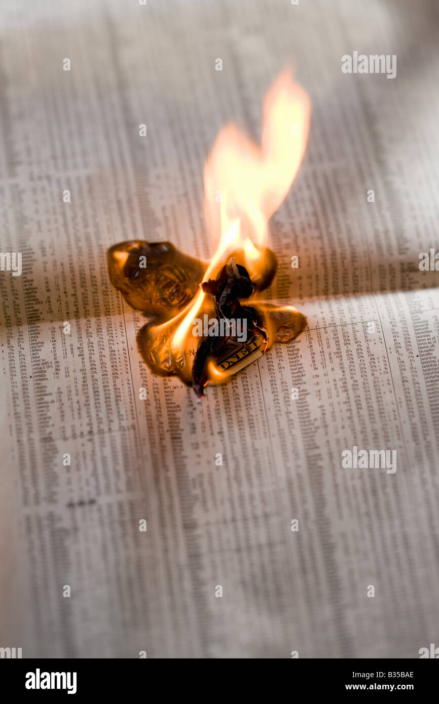 ONE US DOLLAR BILL BURNING ON FINANCIAL PAPER Stock Photo - Alamy