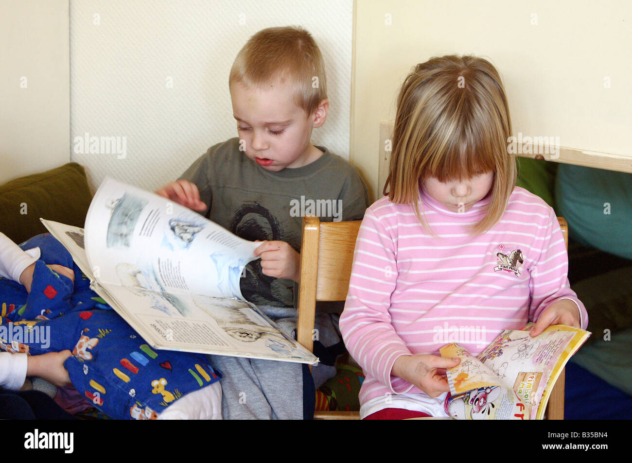 Children reading books in a nursery school in Berlin, Germany Stock ...