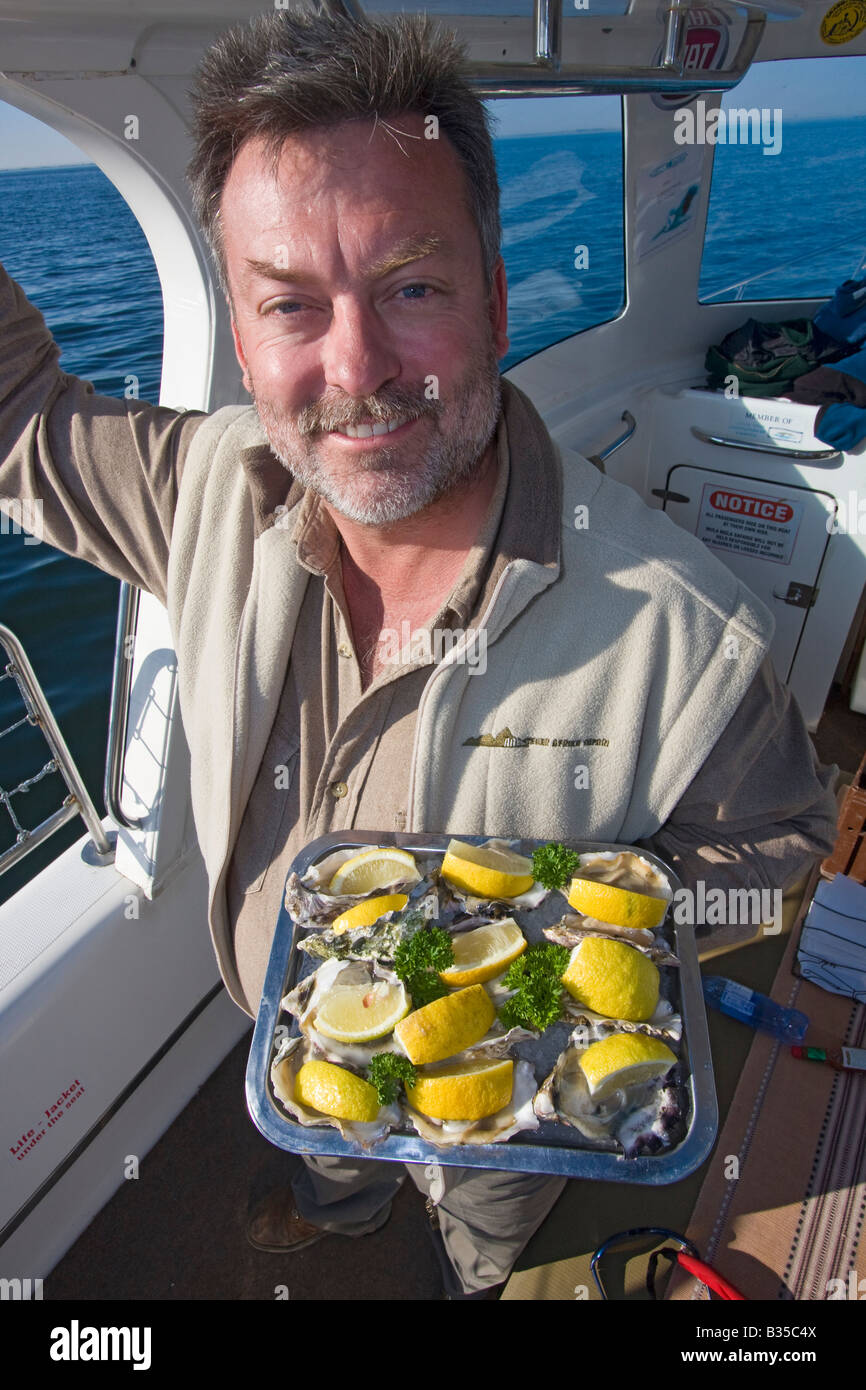 Oyster appetizer on tour boat in Walvis Bay just south of Swakopmund a ...