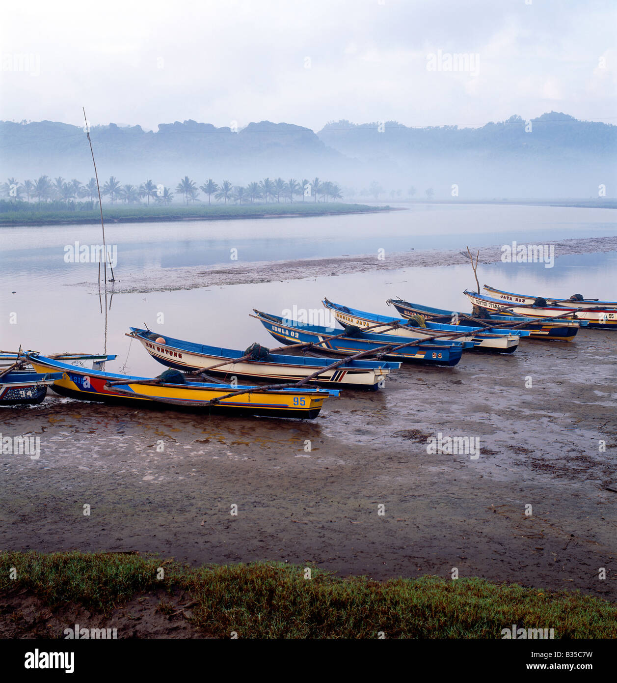 Wooden boats on Bodo Ijo River near Ayah, south coast of Java ...