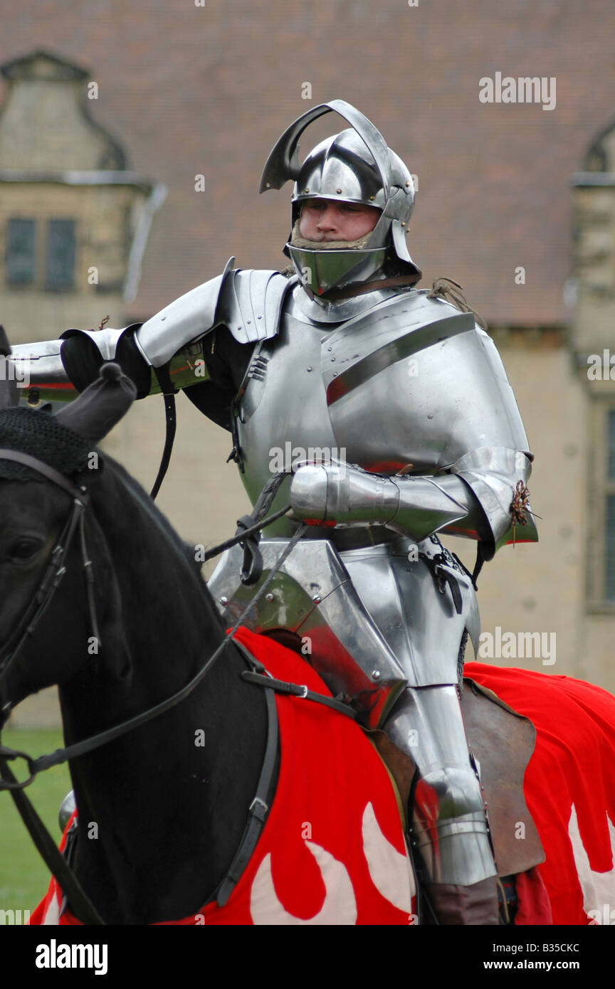 Red knight in armour on horseback Stock Photo - Alamy